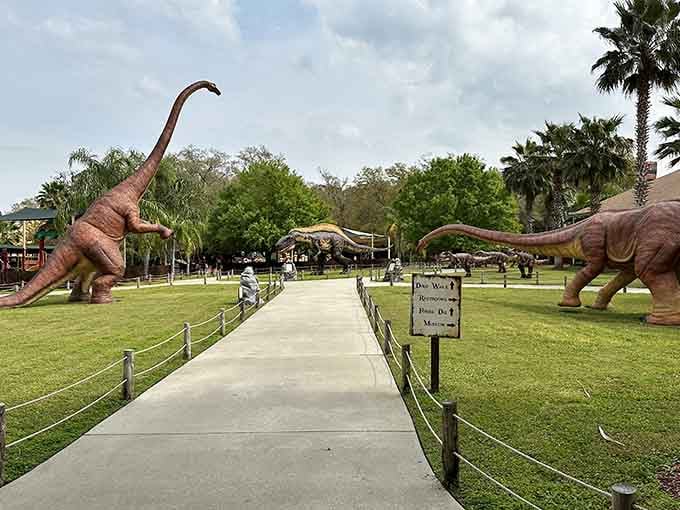 Life-size dinosaurs flank the entrance path like Jurassic Park's friendlier, more photogenic cousins welcoming visitors.