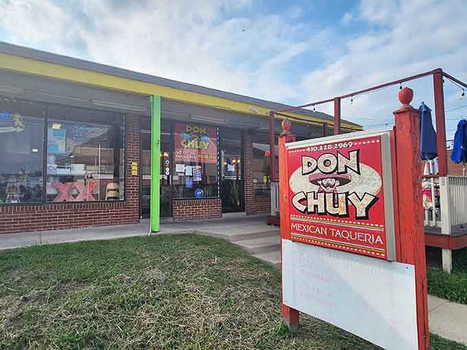 That bold red sign stands proud against blue skies, marking the spot where Cambridge comes for authentic flavors.