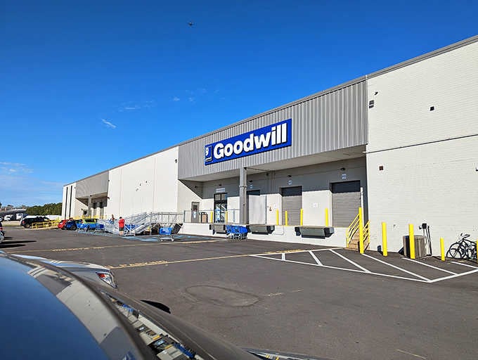 Those loading dock doors hint at the warehouse-scale operation where thrift shopping becomes a pay-by-pound adventure sport.