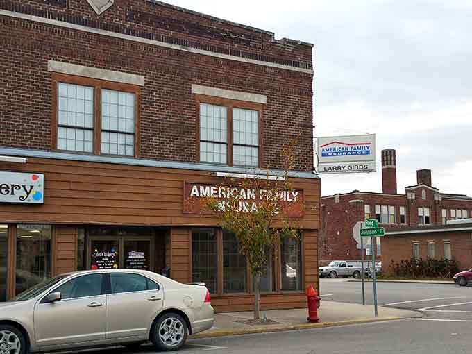 Classic brick and wood storefronts line these streets where neighbors still know your name and your coffee order.