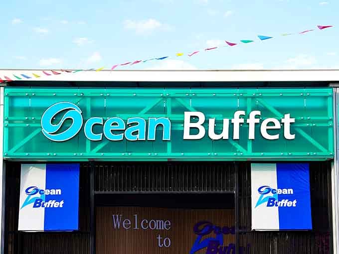 The turquoise wave design splashing across Ocean Buffet's facade captures the essence of seaside dining in Orlando.