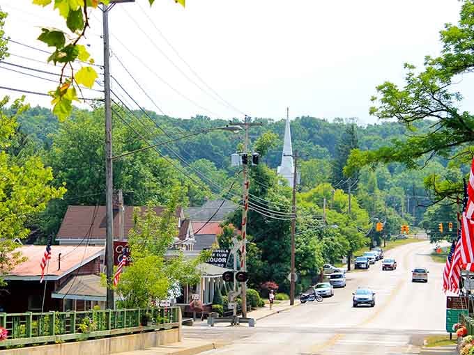 Tree-lined streets slope gently downward, flags waving overhead, creating the quintessential American small-town vista we all cherish.