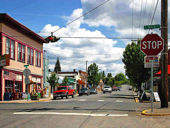 Small-town streets welcome you with genuine warmth, where stop signs mean neighbors actually wave at each other.