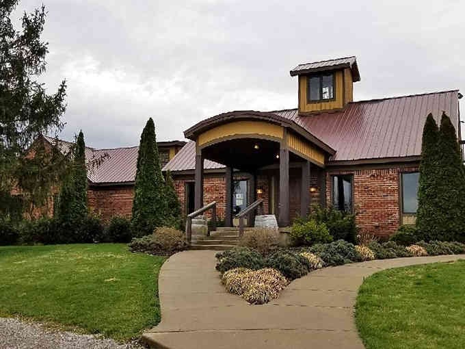 Modern rustic architecture blends beautifully with manicured landscaping, proving contemporary design can still feel welcoming and warm.