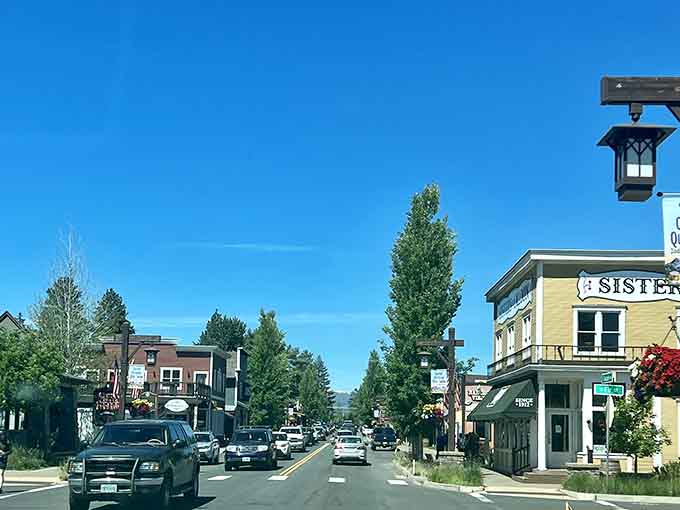 Modern Western storefronts line both sides of the street under that brilliant blue Central Oregon sky.
