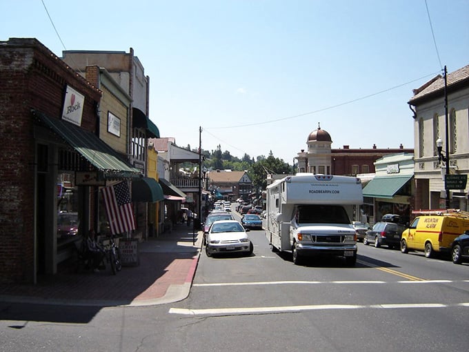 The distinctive dome building anchors this Gold Rush downtown where RVs and locals share the road peacefully.
