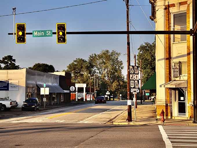 Golden hour on Main Street reveals a town where traffic lights outnumber the traffic in the best way.