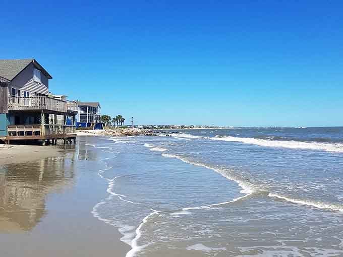 Weathered beach cottages stand guard over gentle surf that's been lapping these shores for generations untold.