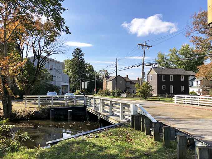 A charming footbridge crosses the creek, connecting neighborhoods like something from a Norman Rockwell painting.