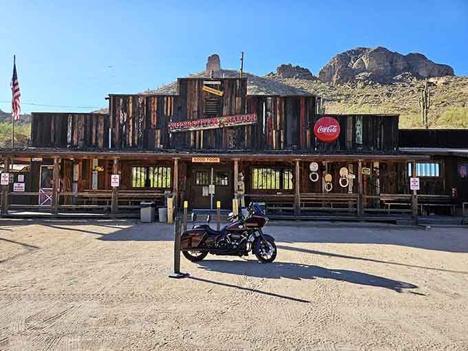 Weathered wood and mountain backdrop create the kind of authentic Western atmosphere Hollywood tries to copy.
