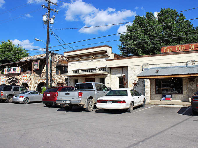Stone buildings cluster together like old friends sharing secrets, their weathered walls holding decades of Hill Country memories.
