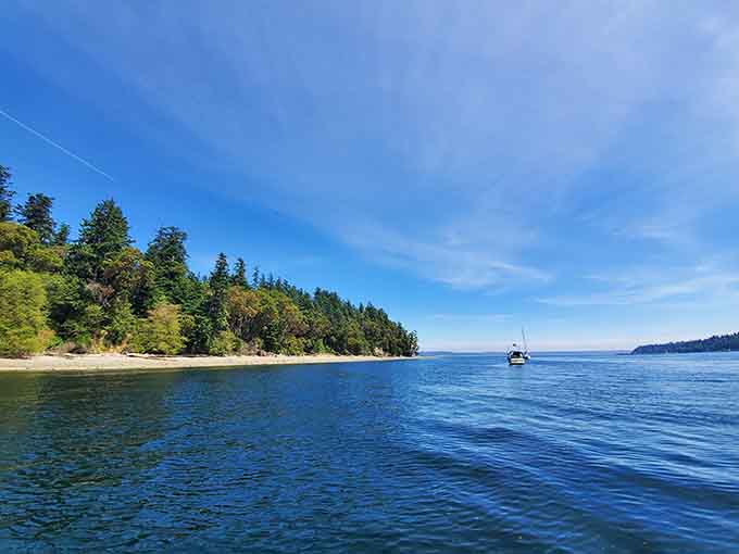 The beach mirrors the sky perfectly as low tide creates nature's own reflecting pool.