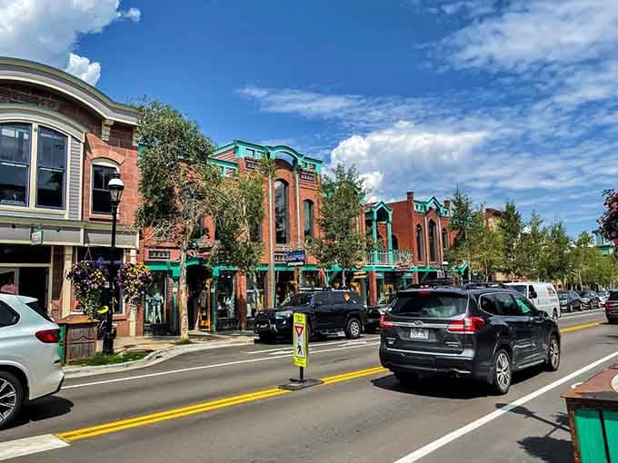 Tree-lined Main Street bustles with summer energy as historic storefronts welcome visitors to explore their mountain town treasures.