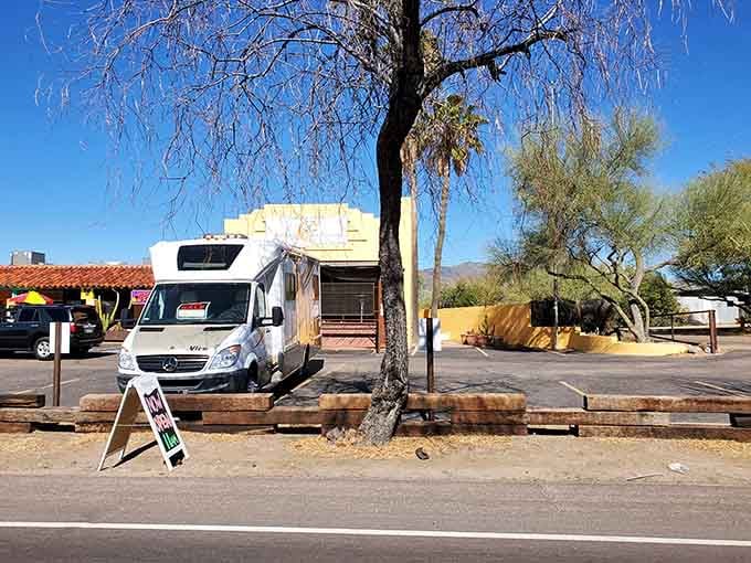 That bare winter tree stands sentinel over a scene where hitching posts would look perfectly natural even today.