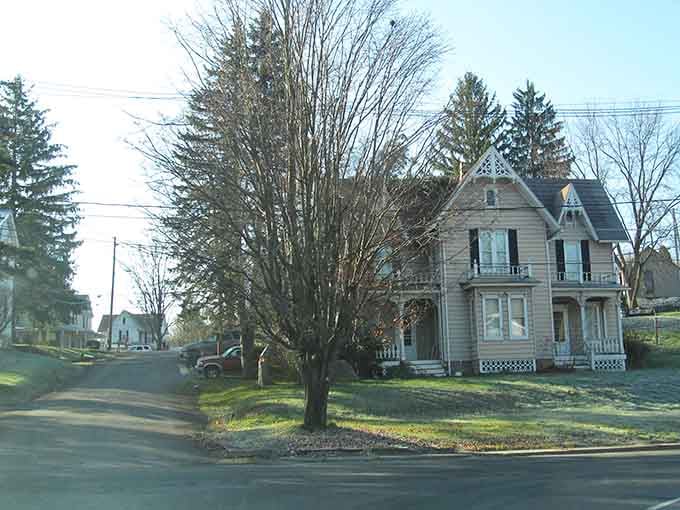 That Victorian mansion with the wraparound porch whispers stories of lemonade summers and front-swing conversations long past.
