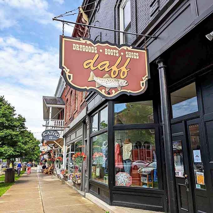 That vintage sign swings gently in the breeze, advertising goods with the kind of style they just don't make anymore.