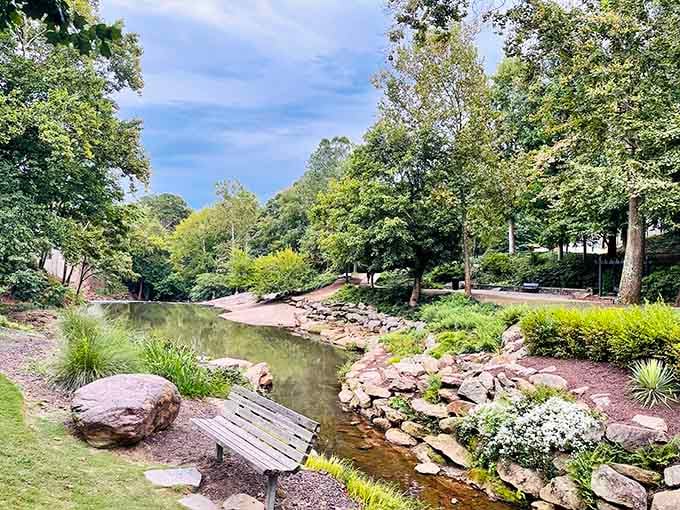 A peaceful stream winds through landscaped banks where every rock seems placed by someone who really cared about details.