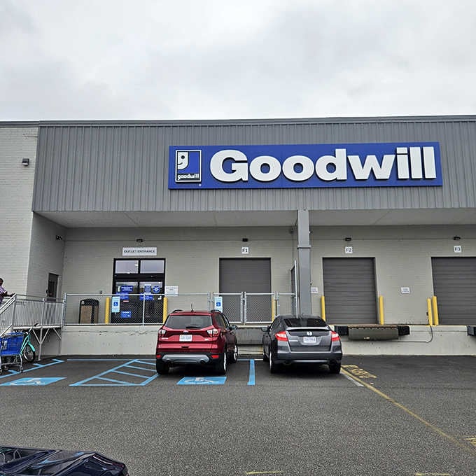 The industrial exterior houses Goodwill's outlet concept where dedicated diggers find incredible deals measured by weight, not tags.
