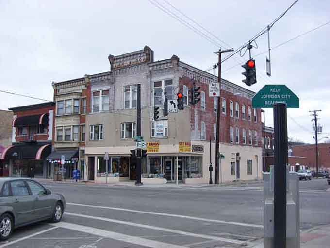 Corner buildings wear their age with dignity, housing local businesses that serve the community rather than corporate shareholders in distant cities.