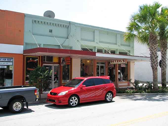Those cheerful palm trees flanking local shops prove small-town charm doesn't require giving up sunshine and warmth.