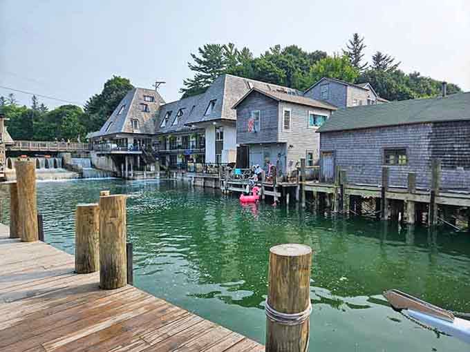 Fishtown's gray wooden buildings lean over green water, their weathered charm proving that authentic beats polished every single time.