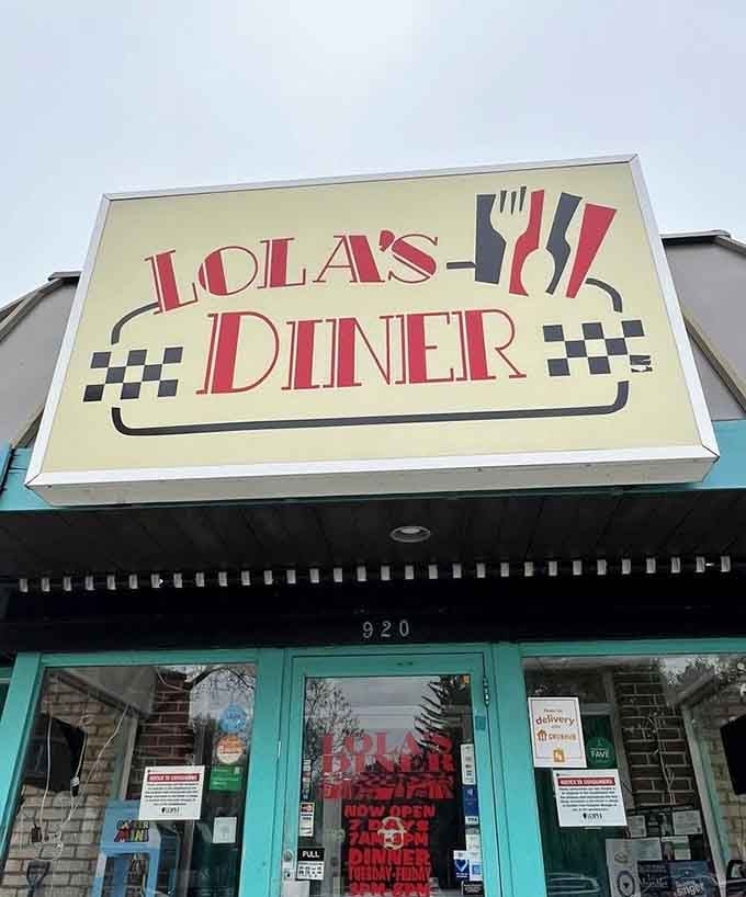 The classic diner sign against turquoise trim creates a picture-perfect postcard from America's beloved roadside dining era.