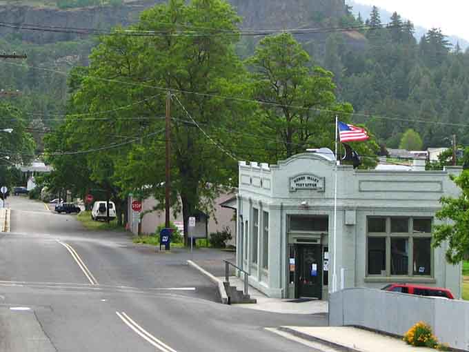 The vintage post office stands crisp and white, a beacon of community connection in an age of email.