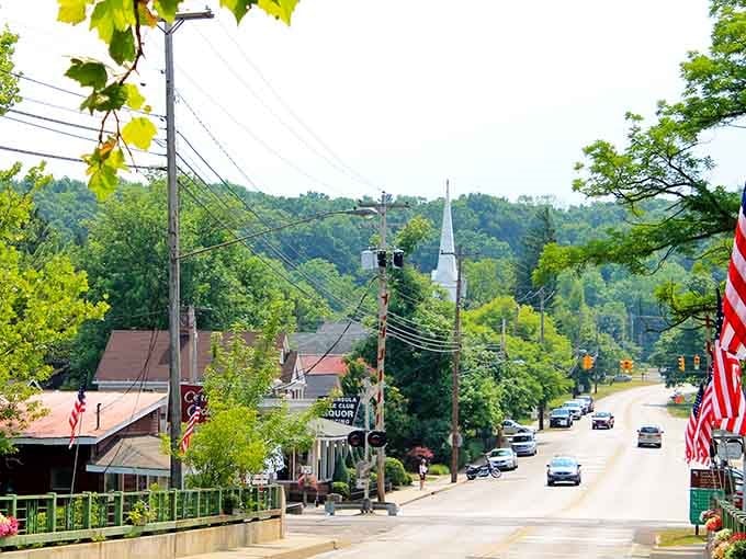That church steeple rises beyond the trees like a gentle reminder that some places still value peaceful living.