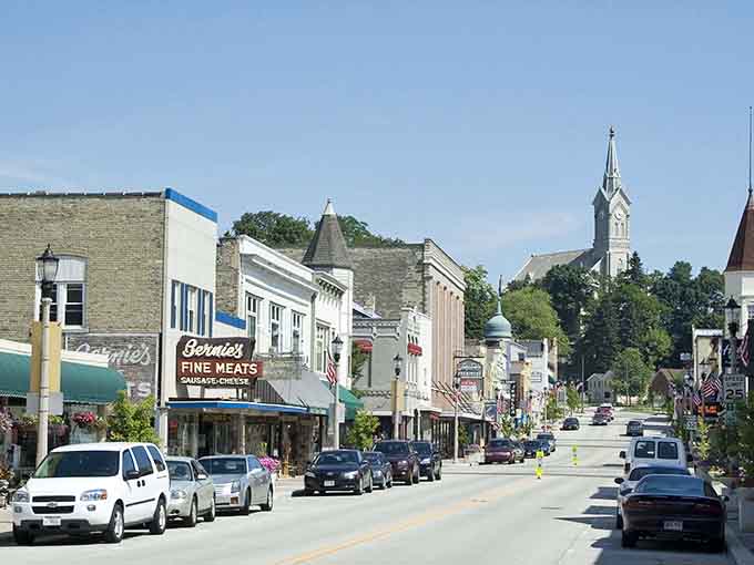 Pastel storefronts and old-fashioned signs line streets where shopping feels like visiting friendly neighbors instead.