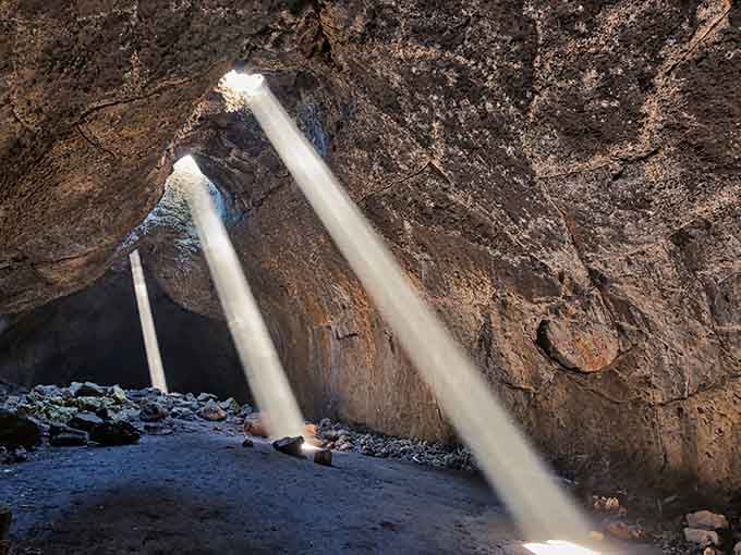 Multiple skylights transform this lava tube into an underground theater, where light and shadow perform their eternal dance together.