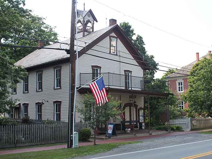 The old fire hall's bell tower and balcony overlook streets where history whispers from every carefully preserved corner.
