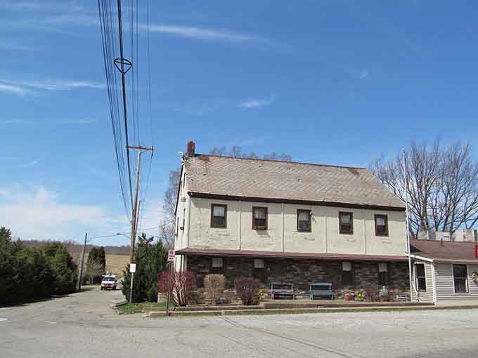 This simple two-story building embodies the practical beauty of a community that valued function as much as form.