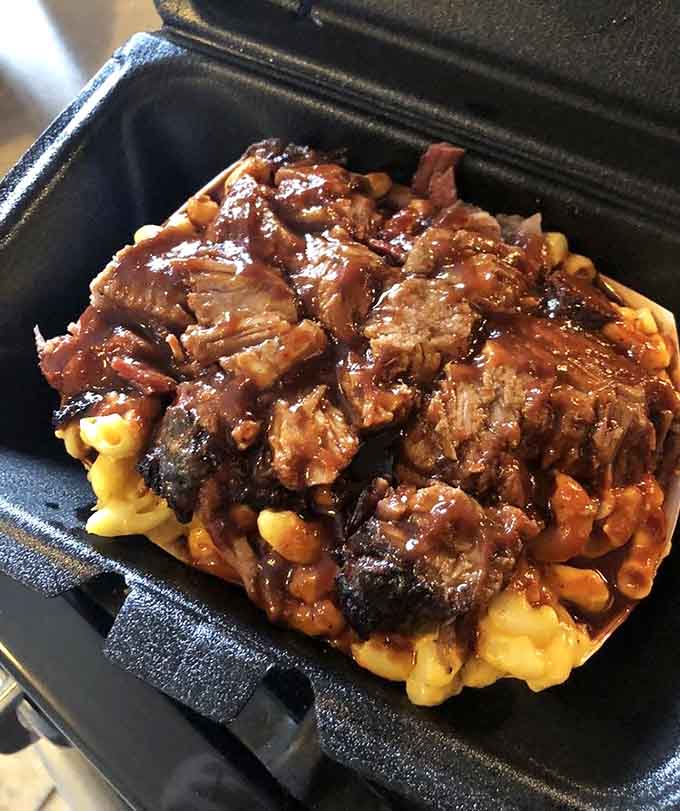 Brisket piled high on mac and cheese is the kind of indulgent combination that makes dieting seem pointless.