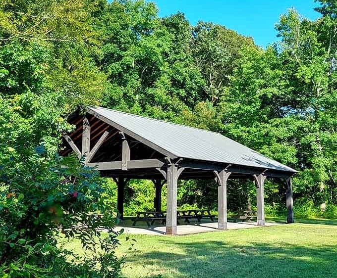This handsome pavilion provides shelter while keeping you connected to the landscape stretching beyond its beams.