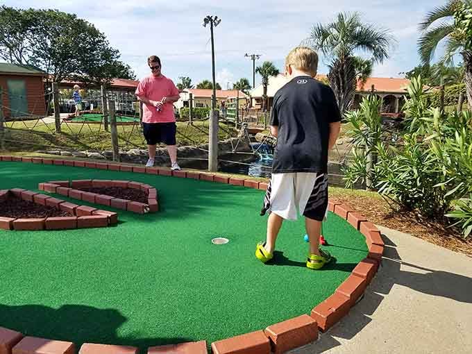 Future PGA champion or just a kid having fun? Either way, that concentration level is impressively serious.