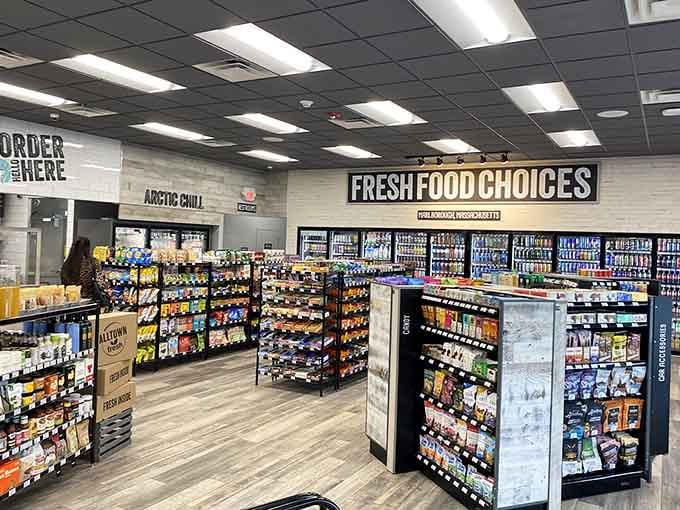 Clean, well-lit aisles showcase fresh options that actually look appetizing instead of apocalypse-ready.