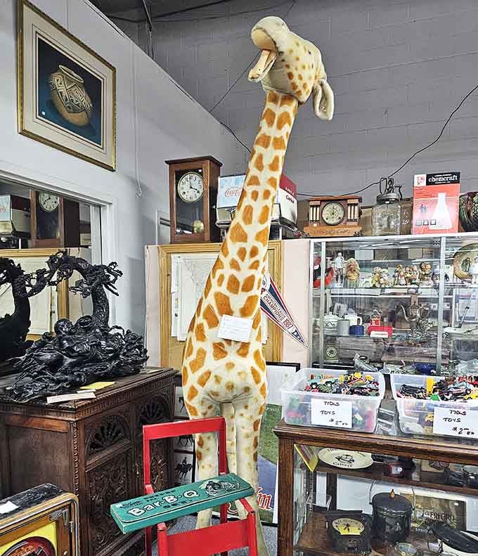 That giant giraffe has seen things, standing sentinel over clocks and curiosities like a whimsical warehouse guardian extraordinaire.