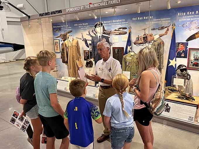 When volunteers share their knowledge with wide-eyed visitors, history transforms from textbook pages into living memories.