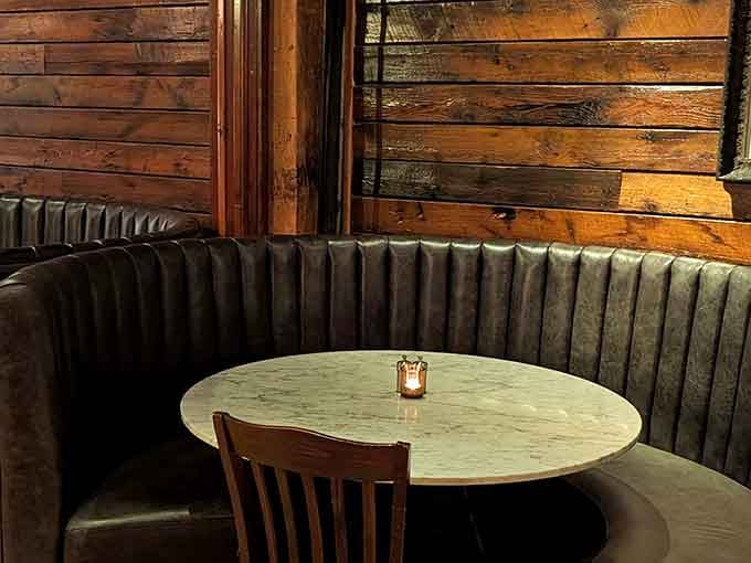 Cozy booths and warm wood tones make you want to settle in for the evening and never leave.