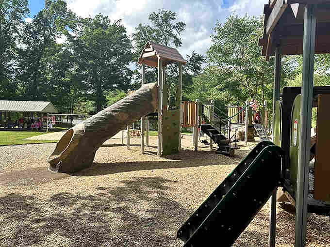The playground gives kids their own adventure while you contemplate whether the slide counts as cardio for adults.