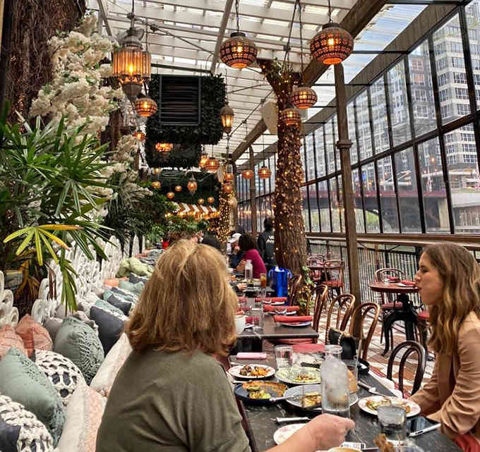 Dining under Moroccan lanterns by the river, where every meal feels like you've stumbled into someone's incredibly chic travel documentary.