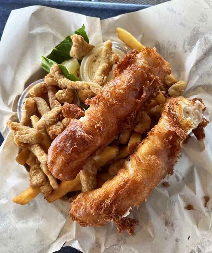 Golden fried cod meets crispy clam strips in a combination that should probably be considered a controlled substance for seafood addicts.
