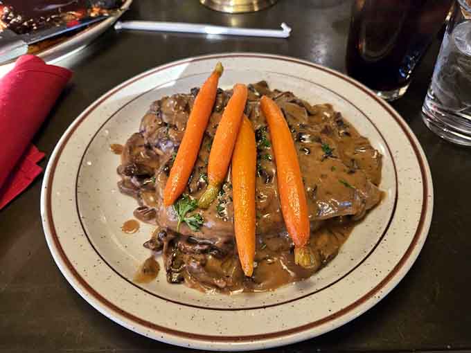 Chicken Marsala with perfectly cooked carrots shows the kitchen's range extends well beyond just grilling meat to perfection.