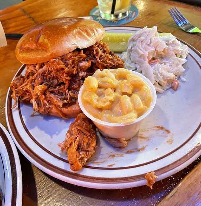 That pulled chicken sandwich towers high with tender meat, proving barbecue isn't just about the ribs after all.