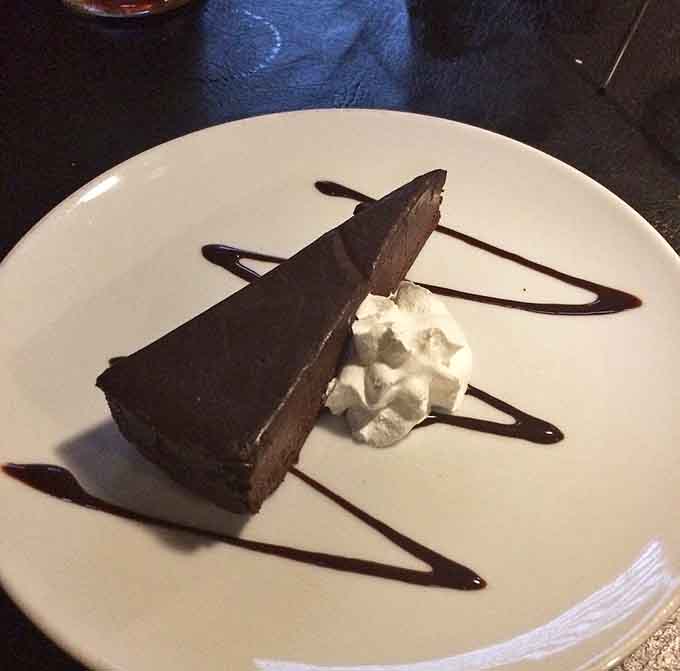 Rich chocolate cake with a drizzle that artistic deserves to be framed before it's devoured completely.