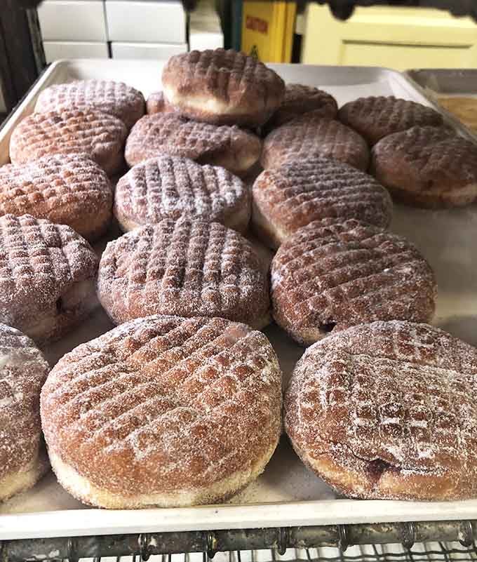 Paczki dusted with enough powdered sugar to create your own personal winter wonderland with every delicious bite.