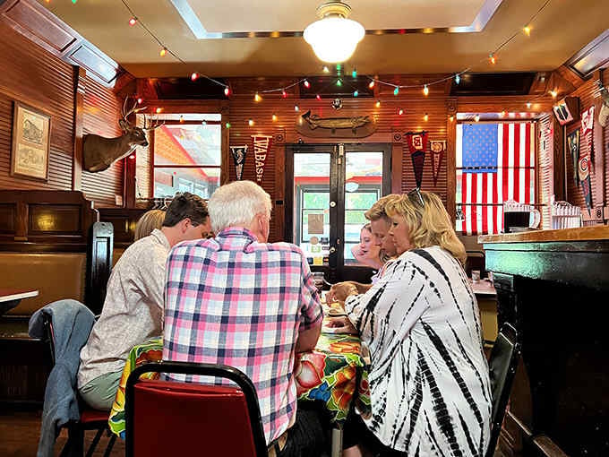 Diners gathered around mismatched tables, united by good food and the universal language of deliciousness.