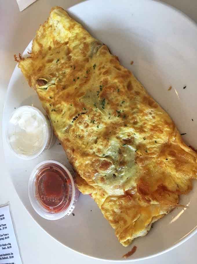 That omelet isn't just folded, it's engineered to hold maximum deliciousness in every fluffy bite.