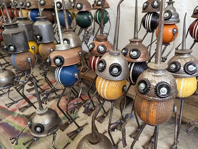 Whimsical robot sculptures crafted from salvaged materials prove one person's junk truly becomes another's quirky garden art masterpiece.