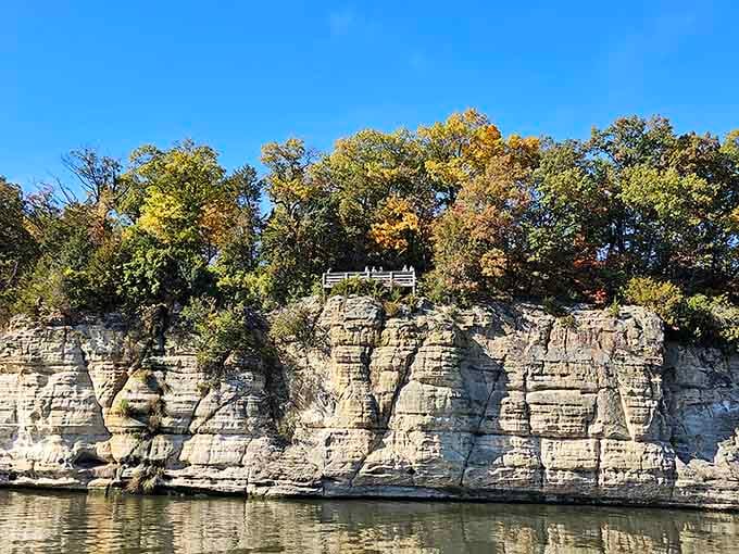 Towering sandstone walls rise from the Illinois River like ancient sentinels guarding secrets from prehistoric seas.